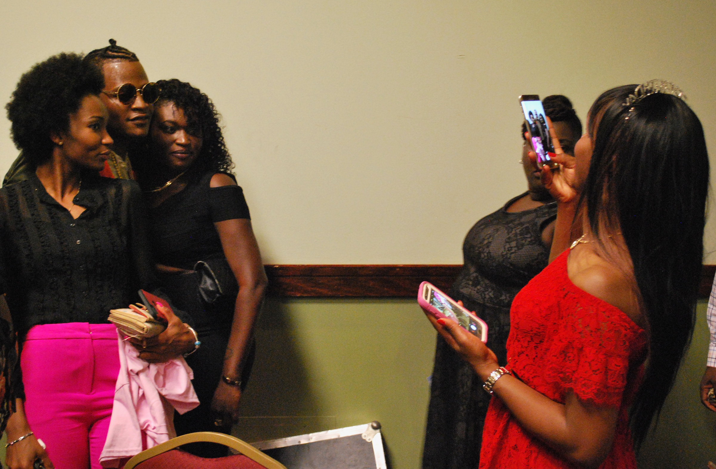 Vladimir Mead, who performs under the name Masterbrain, poses with fans ...