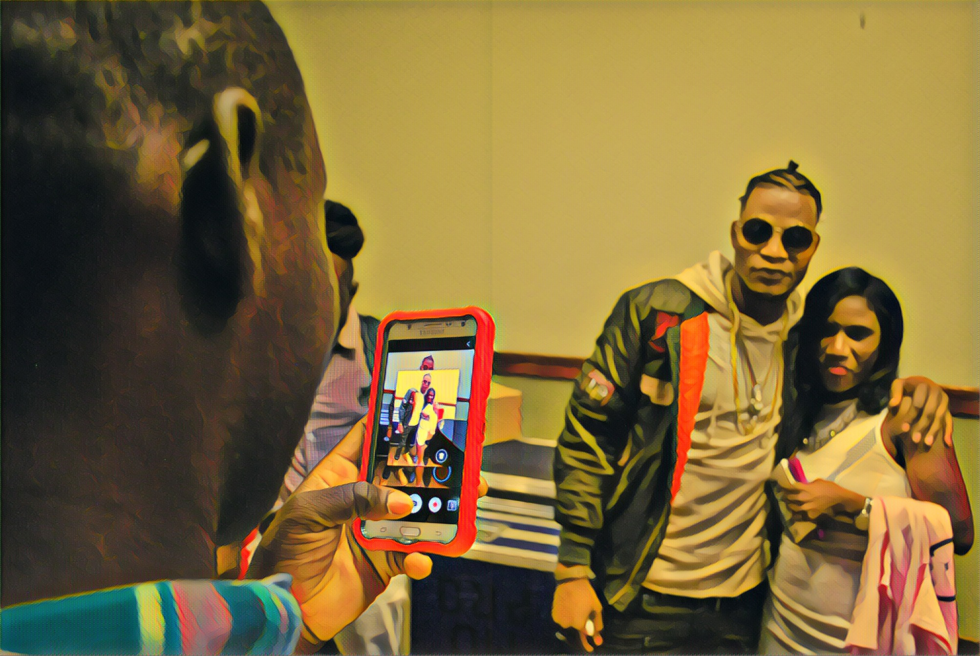 Vladimir Mead, who performs under the name Masterbrain, poses with fans ...